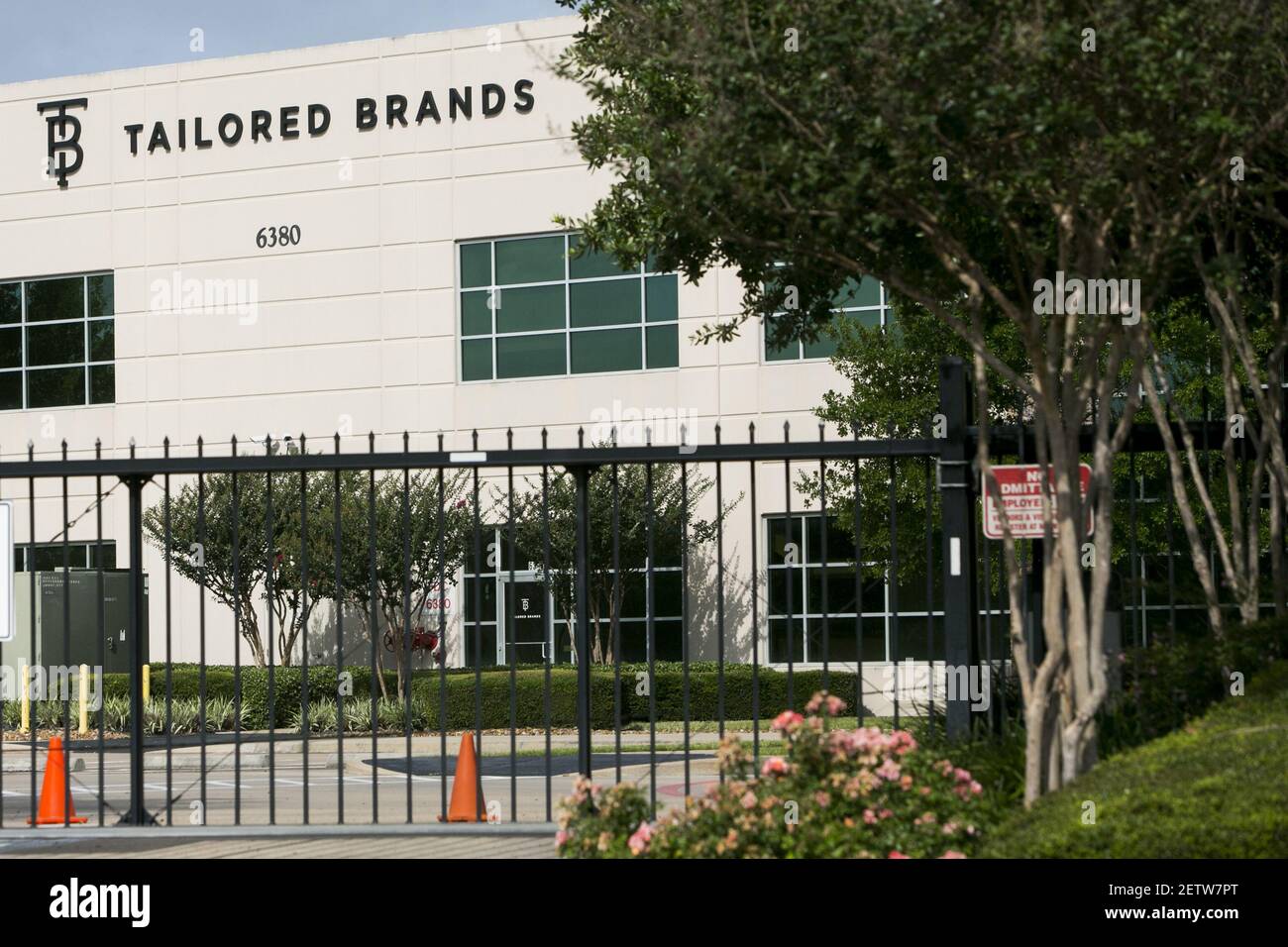 A logo sign outside of the headquarters of Tailored Brands, Inc., the ...