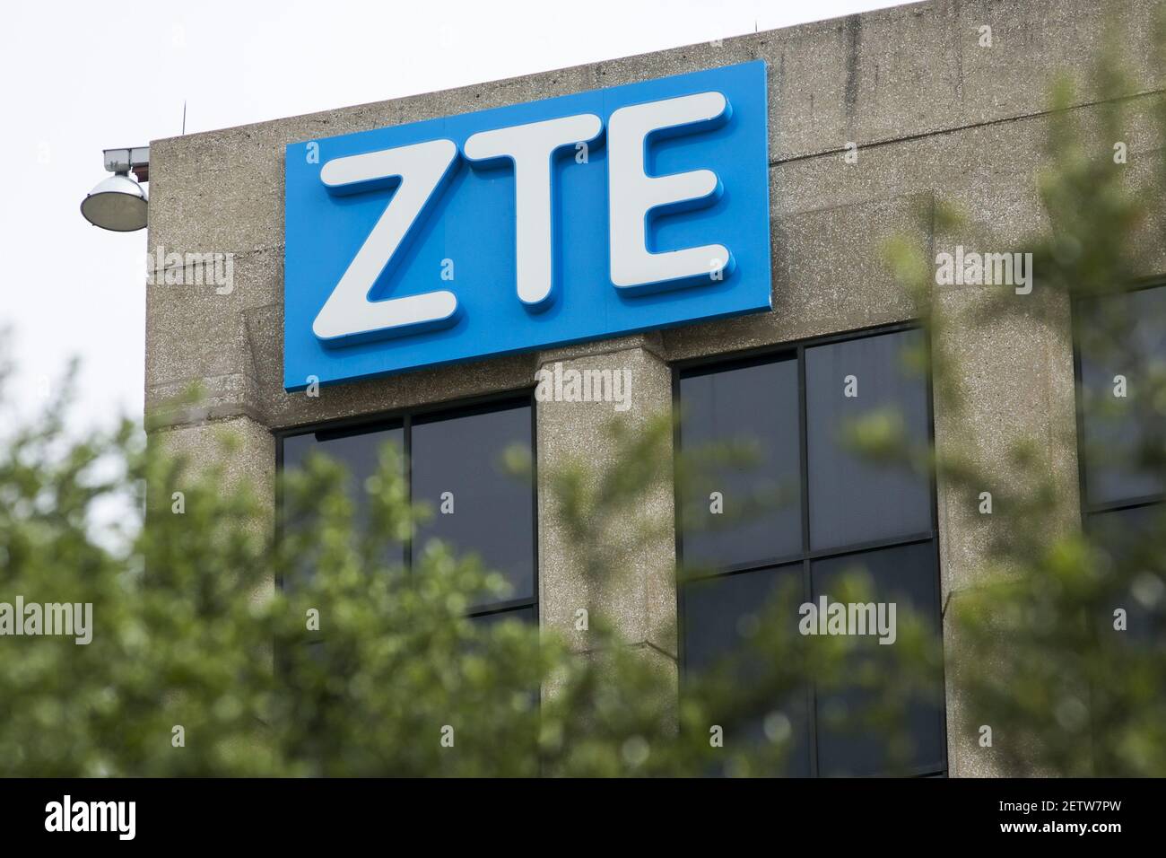 A logo sign outside of a facility occupied by the ZTE Corporation in ...