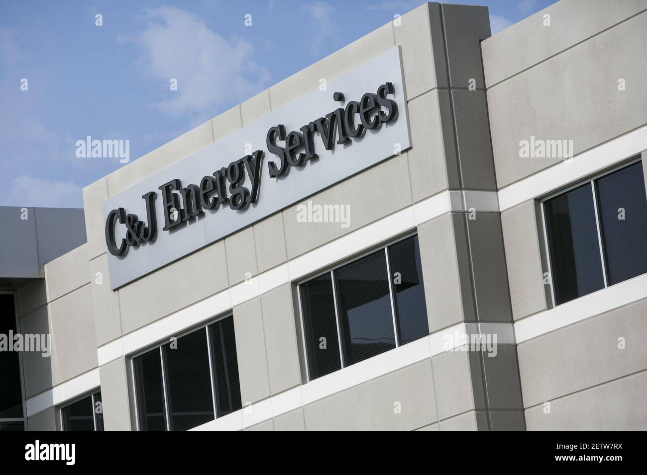 A logo sign outside of the headquarters of C&J Energy Services in ...