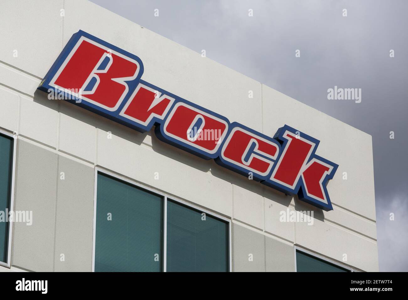 A logo sign outside of a facility occupied by The Brock Group in ...