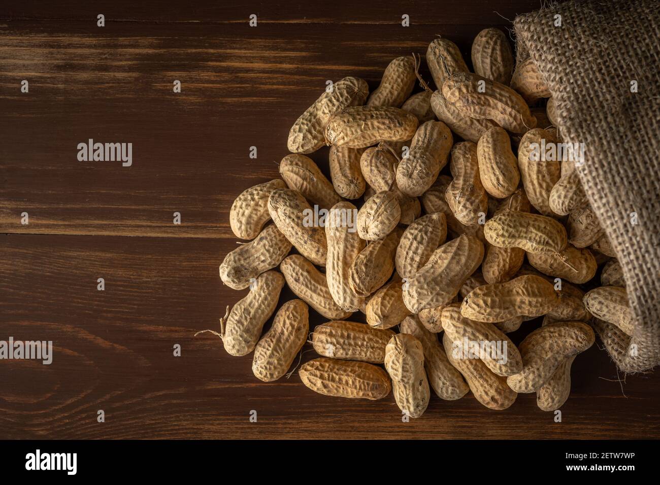 Peanut in sack bag on wooden background. Food background Stock Photo ...