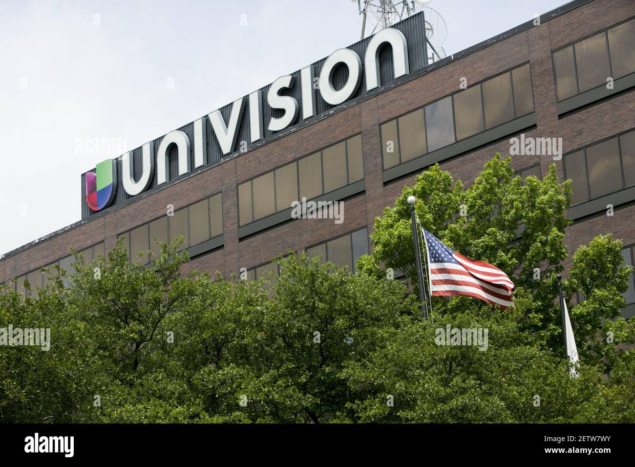 A logo sign outside of a facility occupied by Univision Communications ...