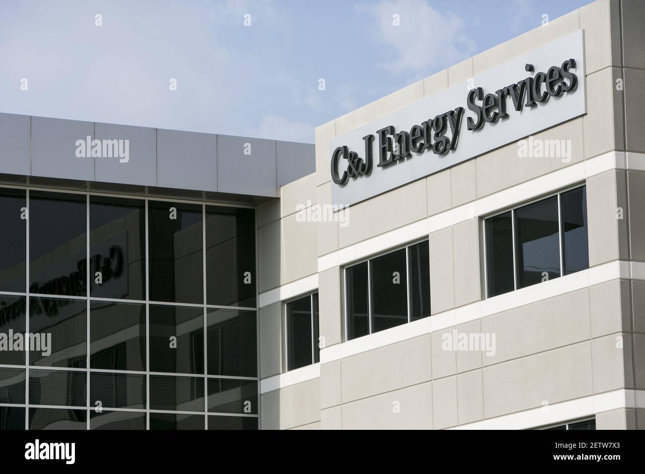A logo sign outside of the headquarters of C&J Energy Services in ...