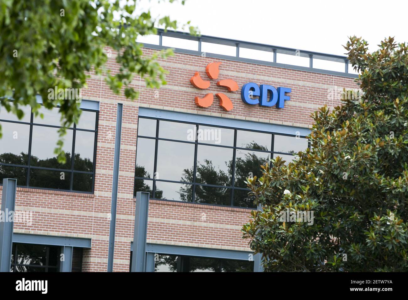 A logo sign outside of a facility occupied by EDF Trading Limited in ...
