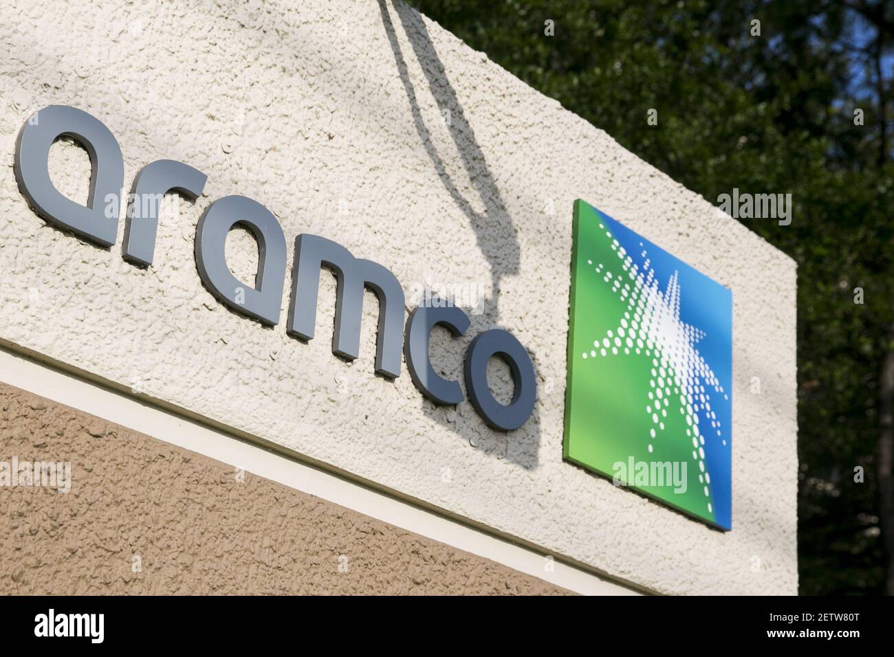 A logo sign outside of a facility occupied by Saudi Aramco in Houston ...