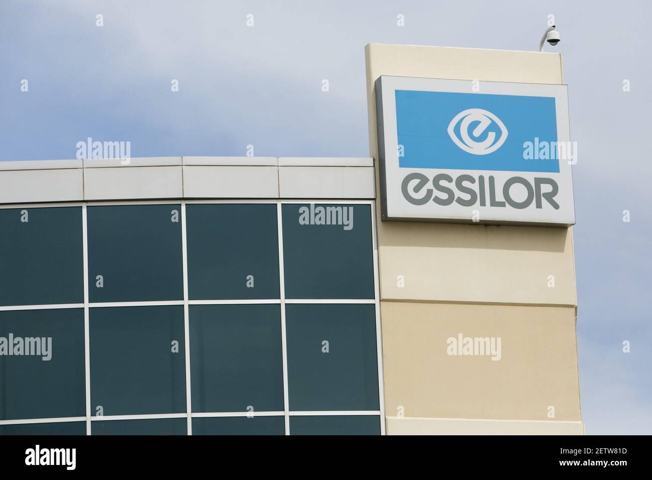 A logo sign outside of the headquarters of Essilor of America in Dallas ...