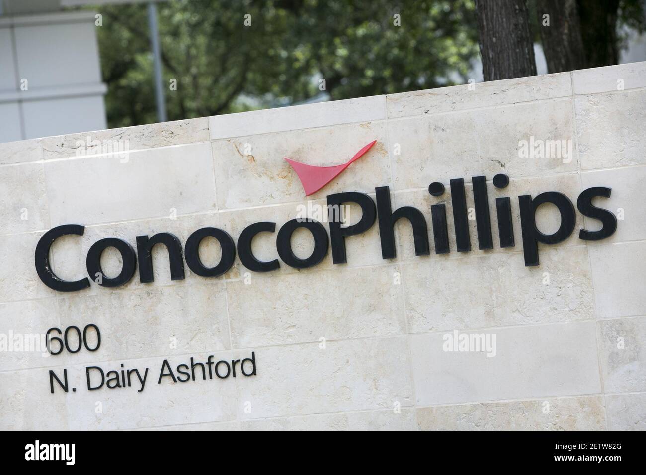 A logo sign outside of the headquarters of the ConocoPhillips Co., in ...