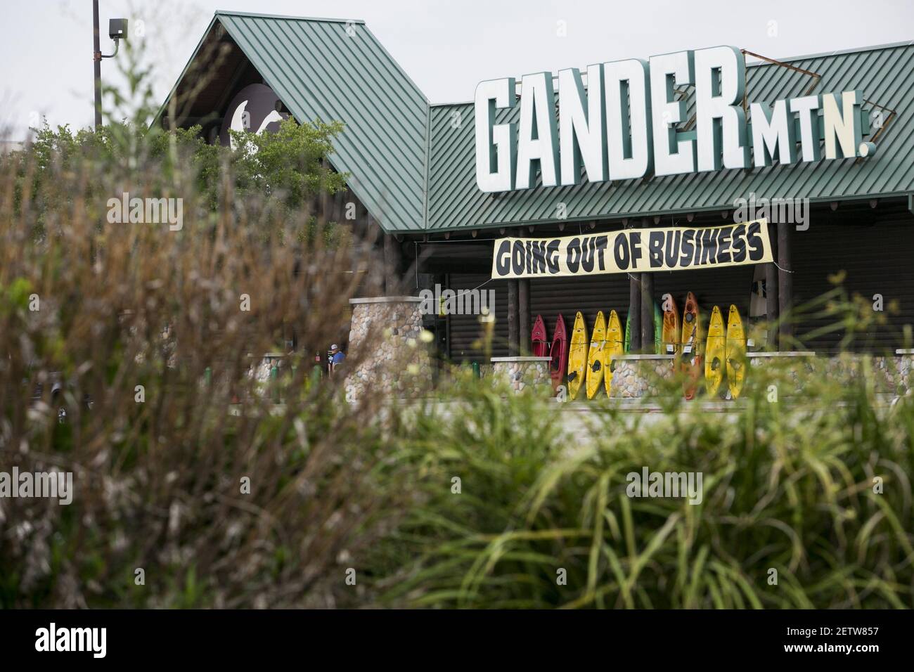 A "Going Out Of Business" banner at a Gander Mountain retail store in ...