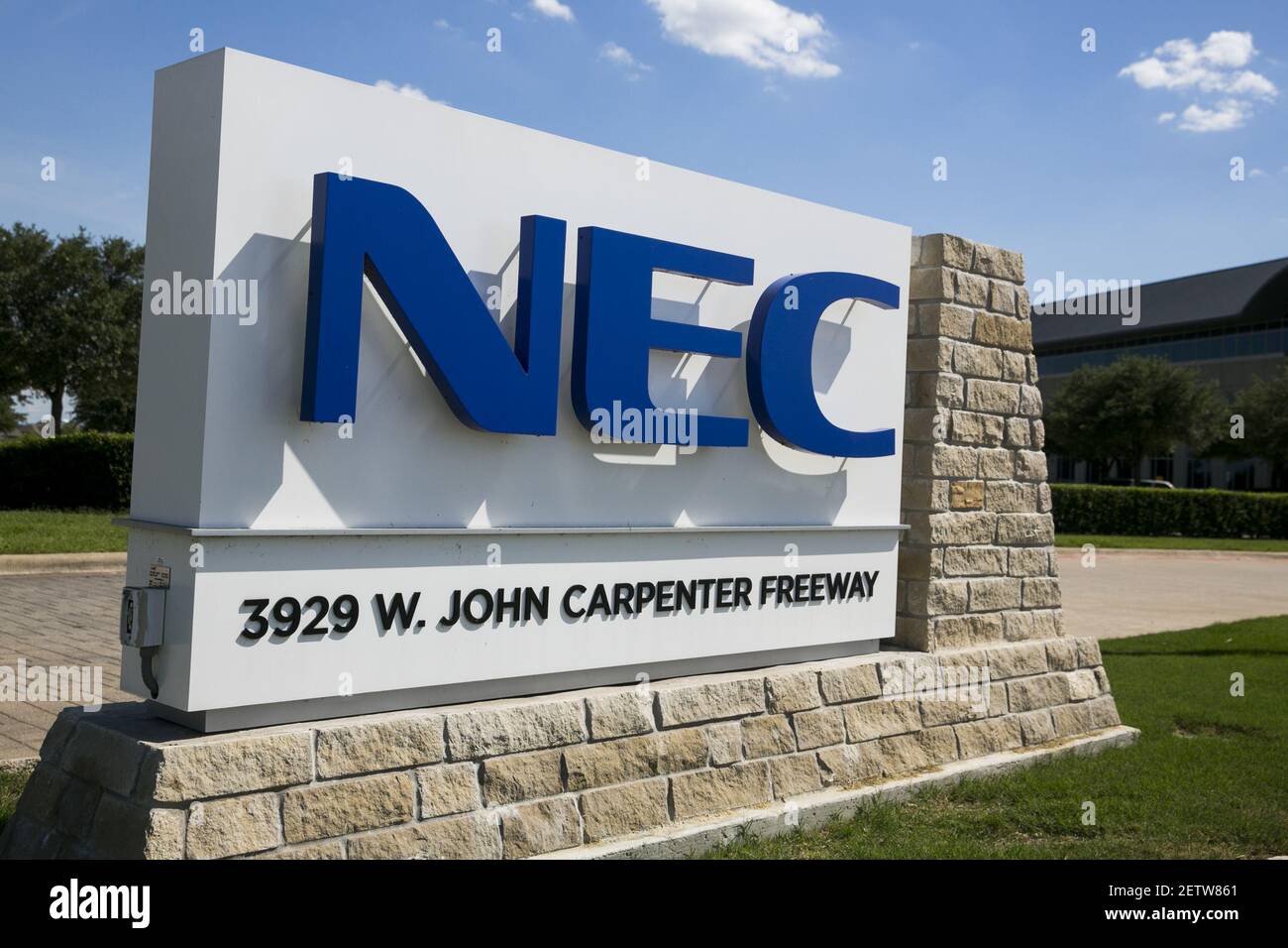 A logo sign outside of a facility occupied by the NEC Corporation in ...