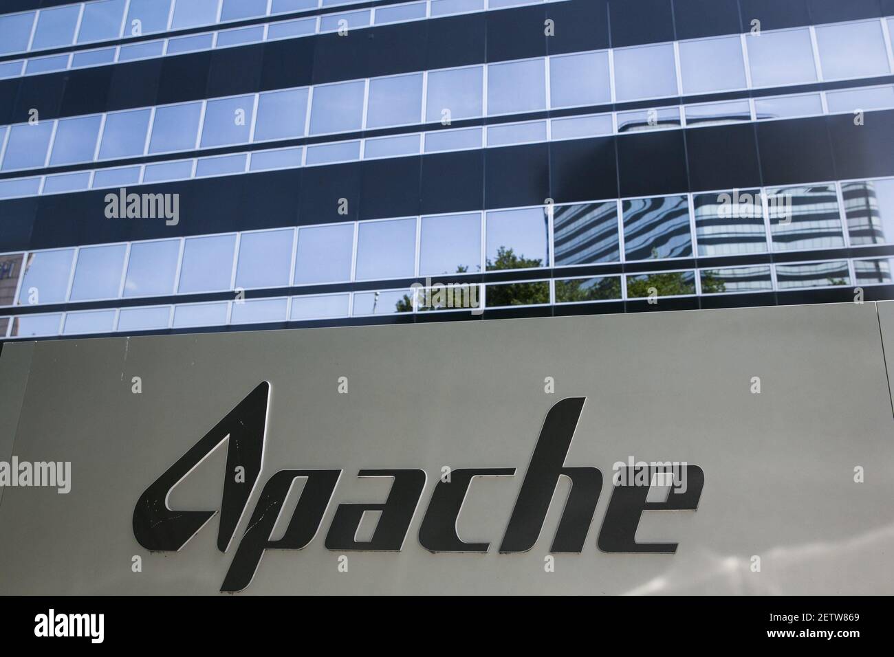 A logo sign outside of the headquarters of the Apache Corporation in ...