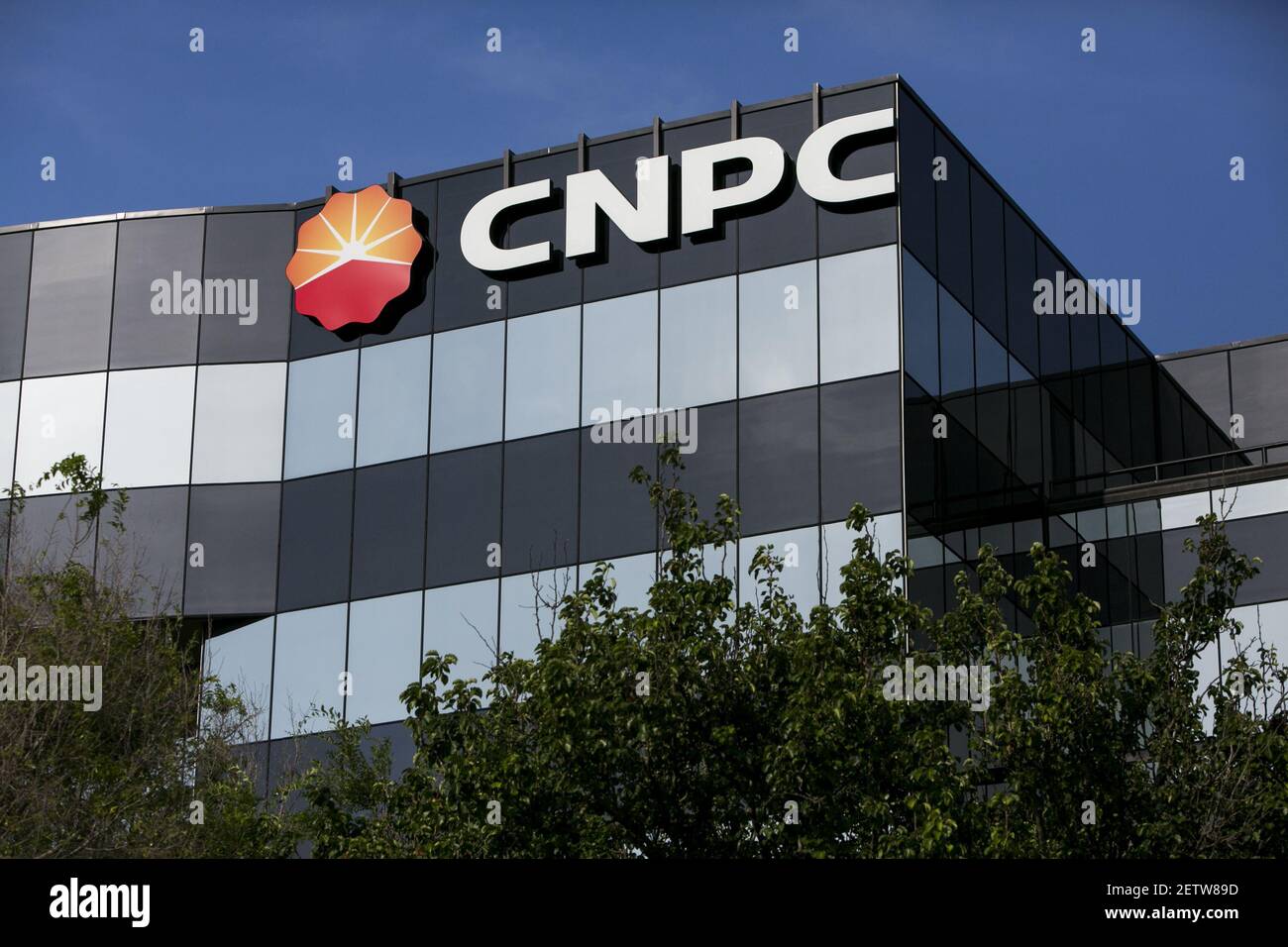 A logo sign outside of a facility occupied by the China National ...