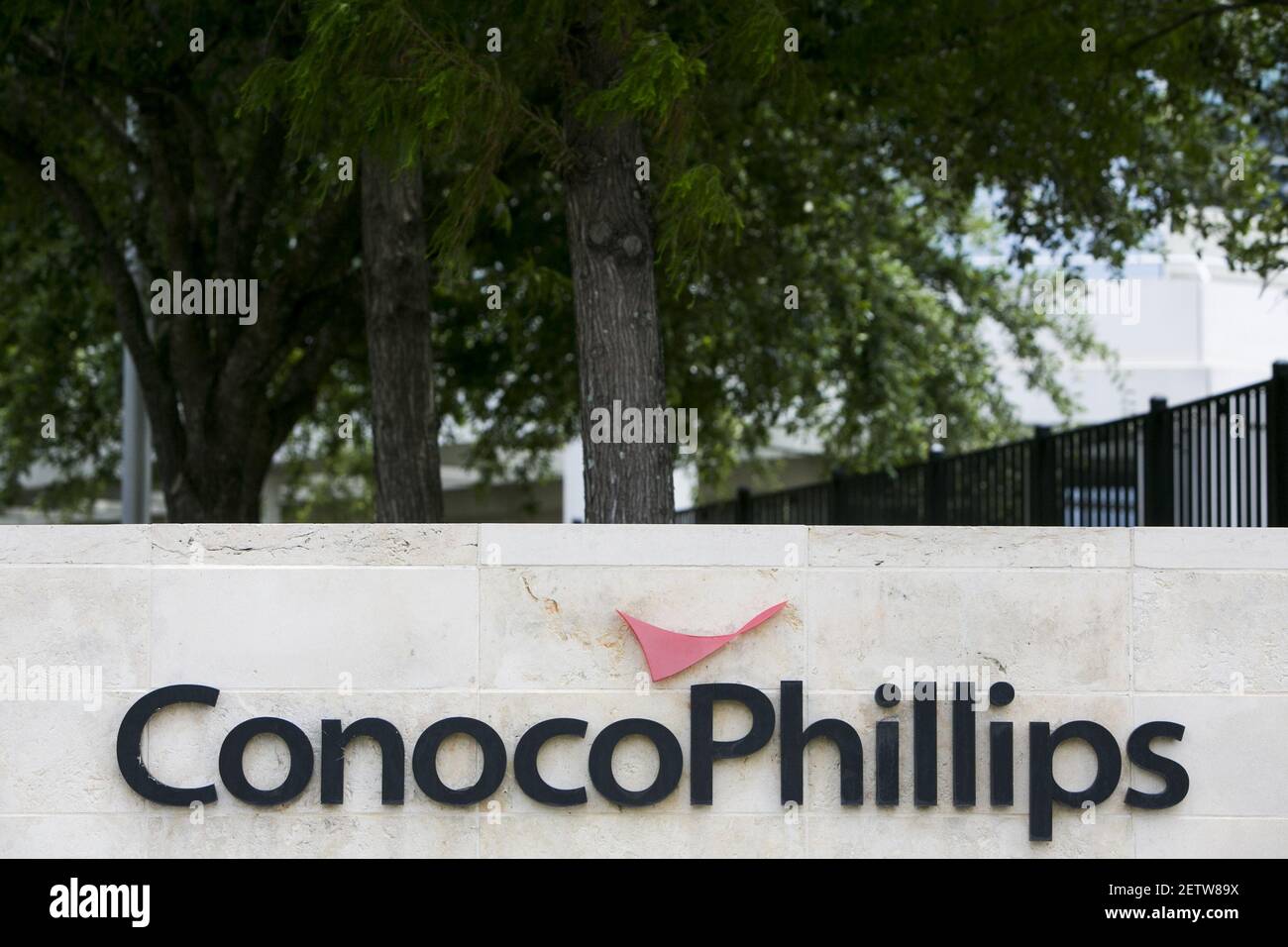 A logo sign outside of the headquarters of the ConocoPhillips Co., in ...
