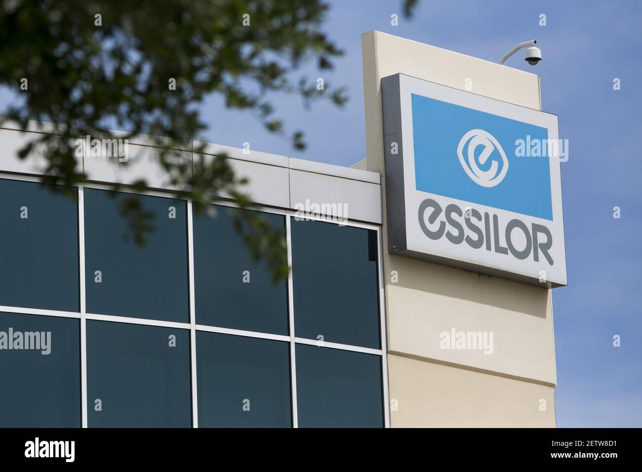 A logo sign outside of the headquarters of Essilor of America in Dallas ...