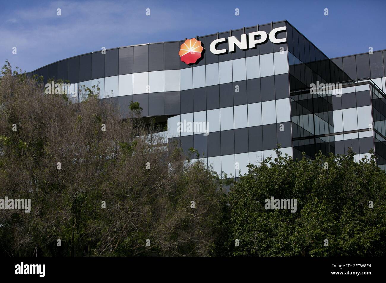 A logo sign outside of a facility occupied by the China National ...