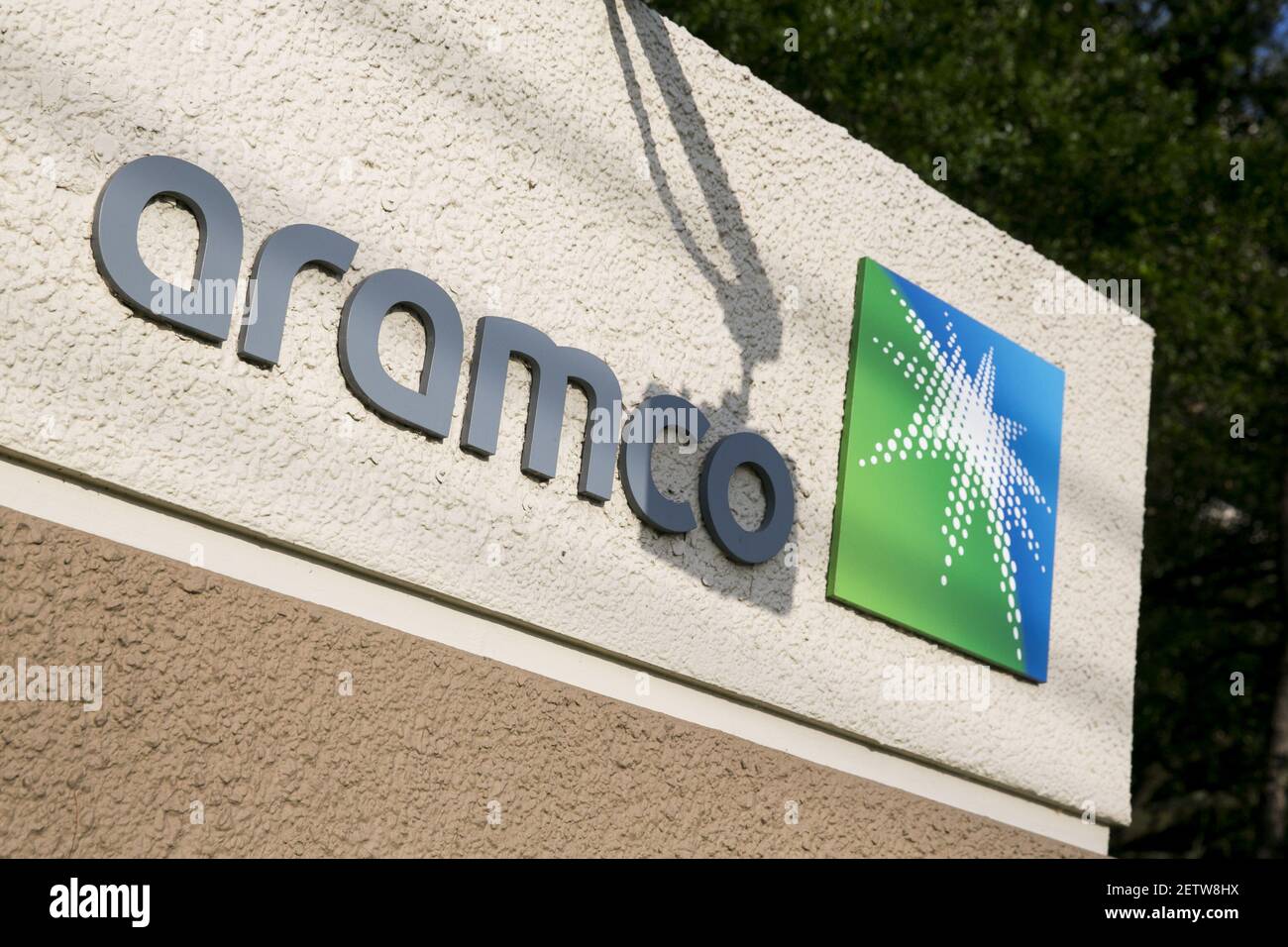 A logo sign outside of a facility occupied by Saudi Aramco in Houston ...