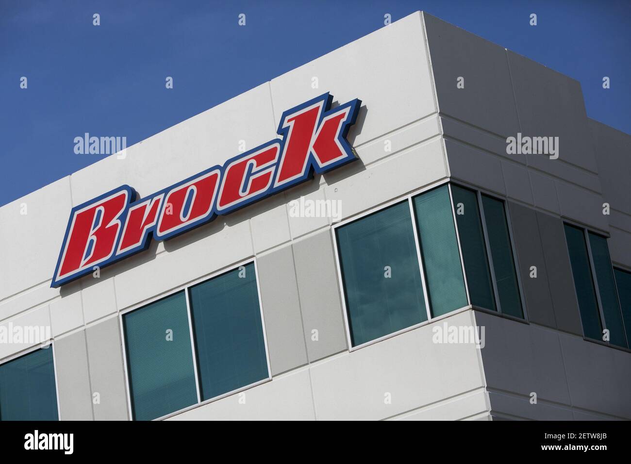 A logo sign outside of a facility occupied by The Brock Group in ...