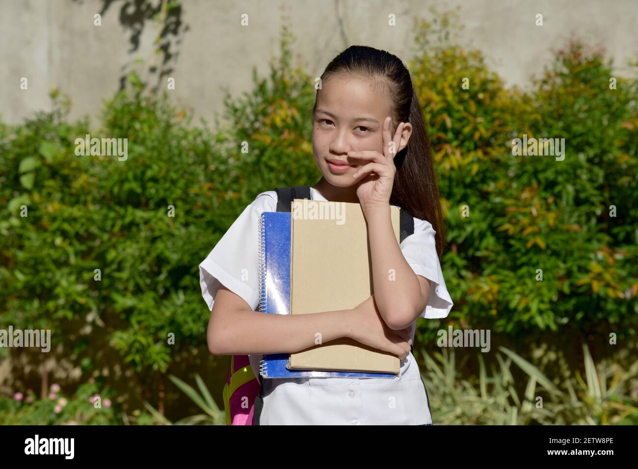 A Pretty Diverse Female Student Thinking Stock Photo - Alamy