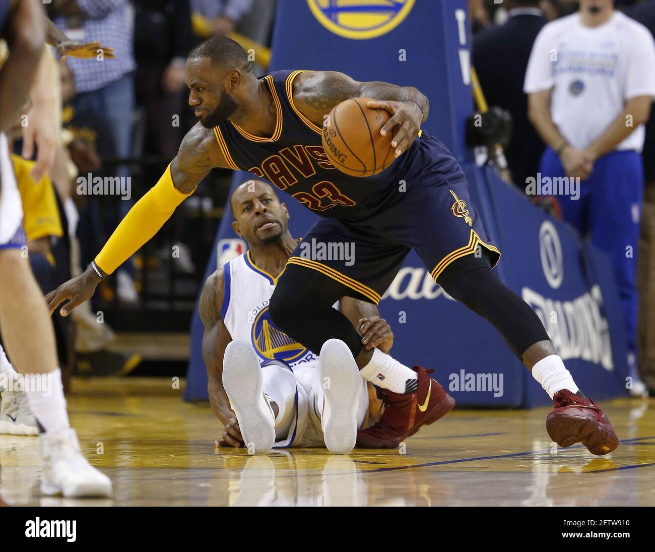 The Cleveland Cavaliers' LeBron James (23) is fouled by the fallen ...