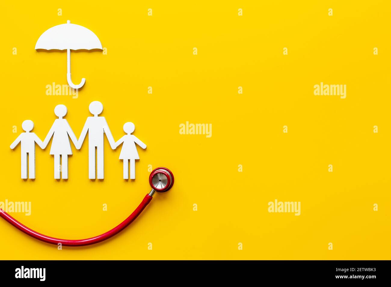 Wooden family figure with stethoscope. Life and health insurance ...