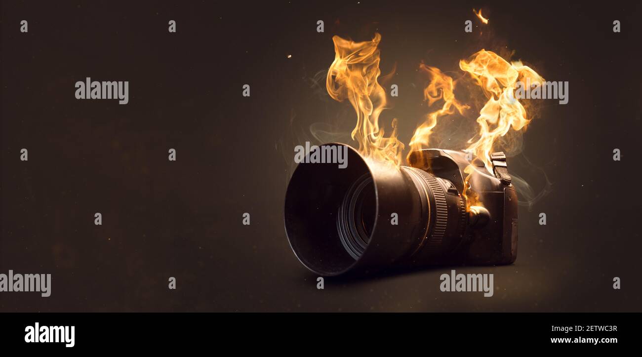 Camera on fire with actual flames Stock Photo - Alamy