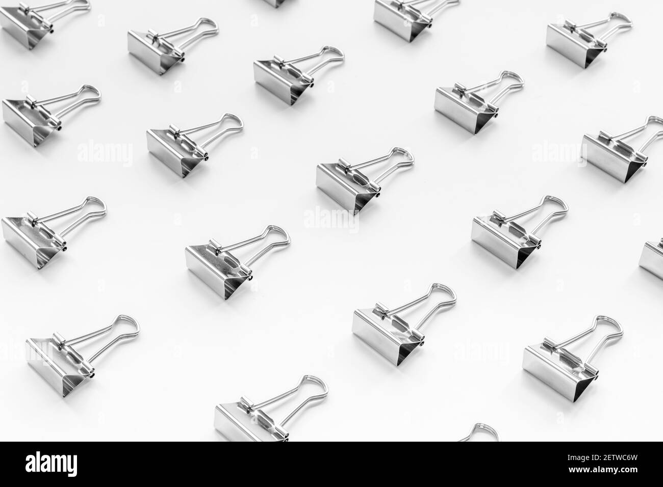 Paper binder clips. Stationery and office supplies background Stock ...