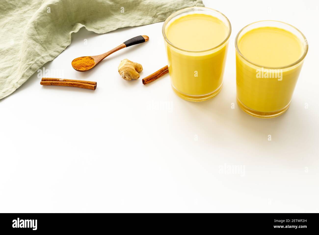 Yellow golden turmeric milk or pumpkin latte with ginger and cinnamon ...