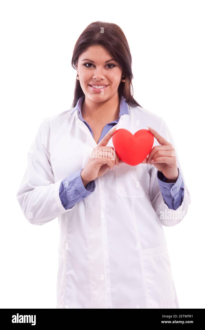 Smiling nurse holding heart isolated on white Stock Photo - Alamy
