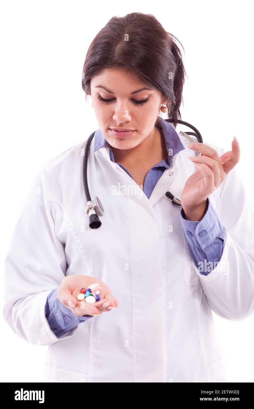 Attractive beautiful nurse holding pills Stock Photo - Alamy