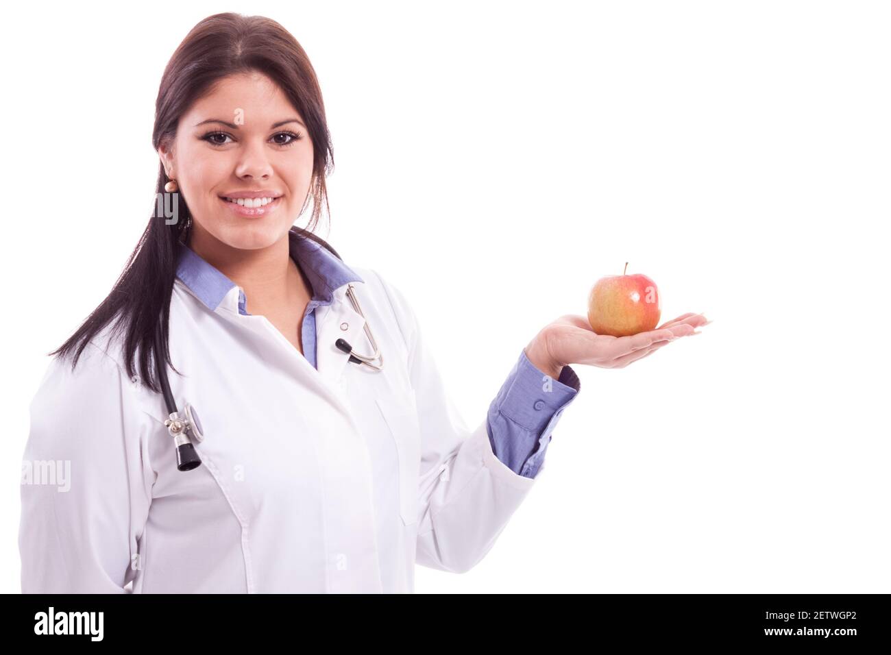 Young nurse holding apple isolated Stock Photo - Alamy
