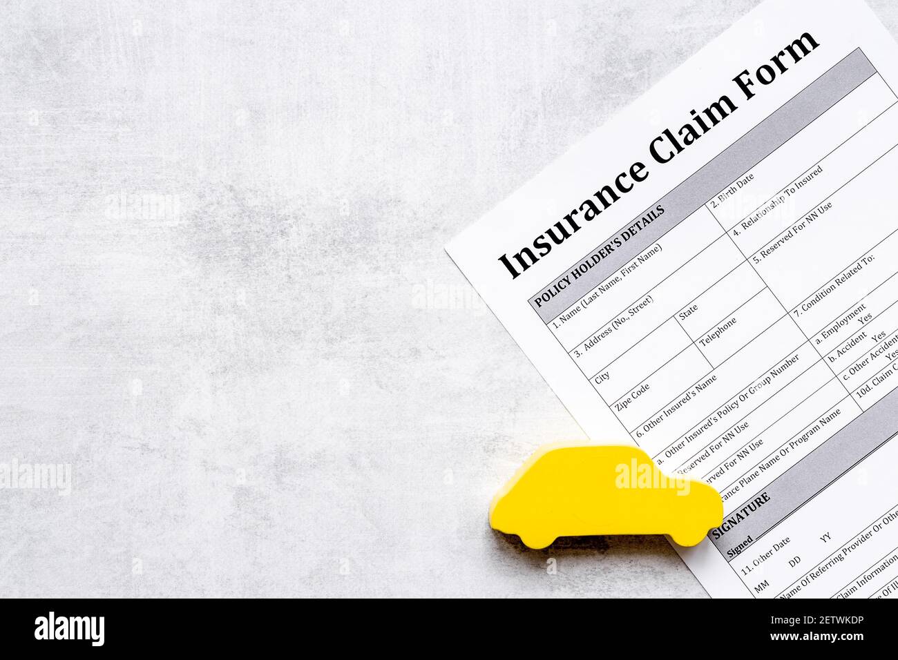 Insurance claim form with car shape. Top view Stock Photo - Alamy