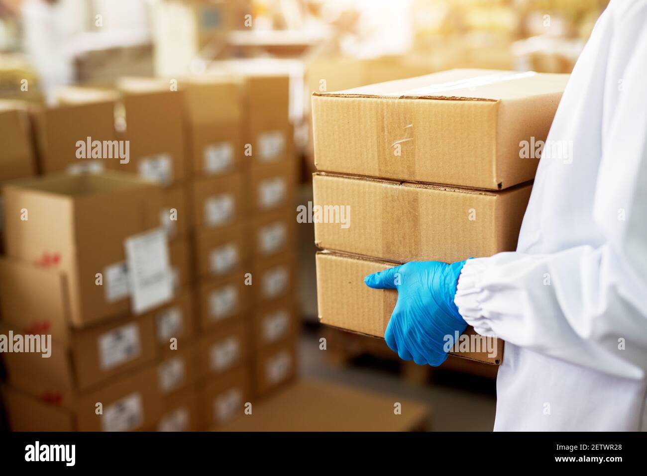 Portrait factory carrying cardboard boxes hi-res stock photography and ...