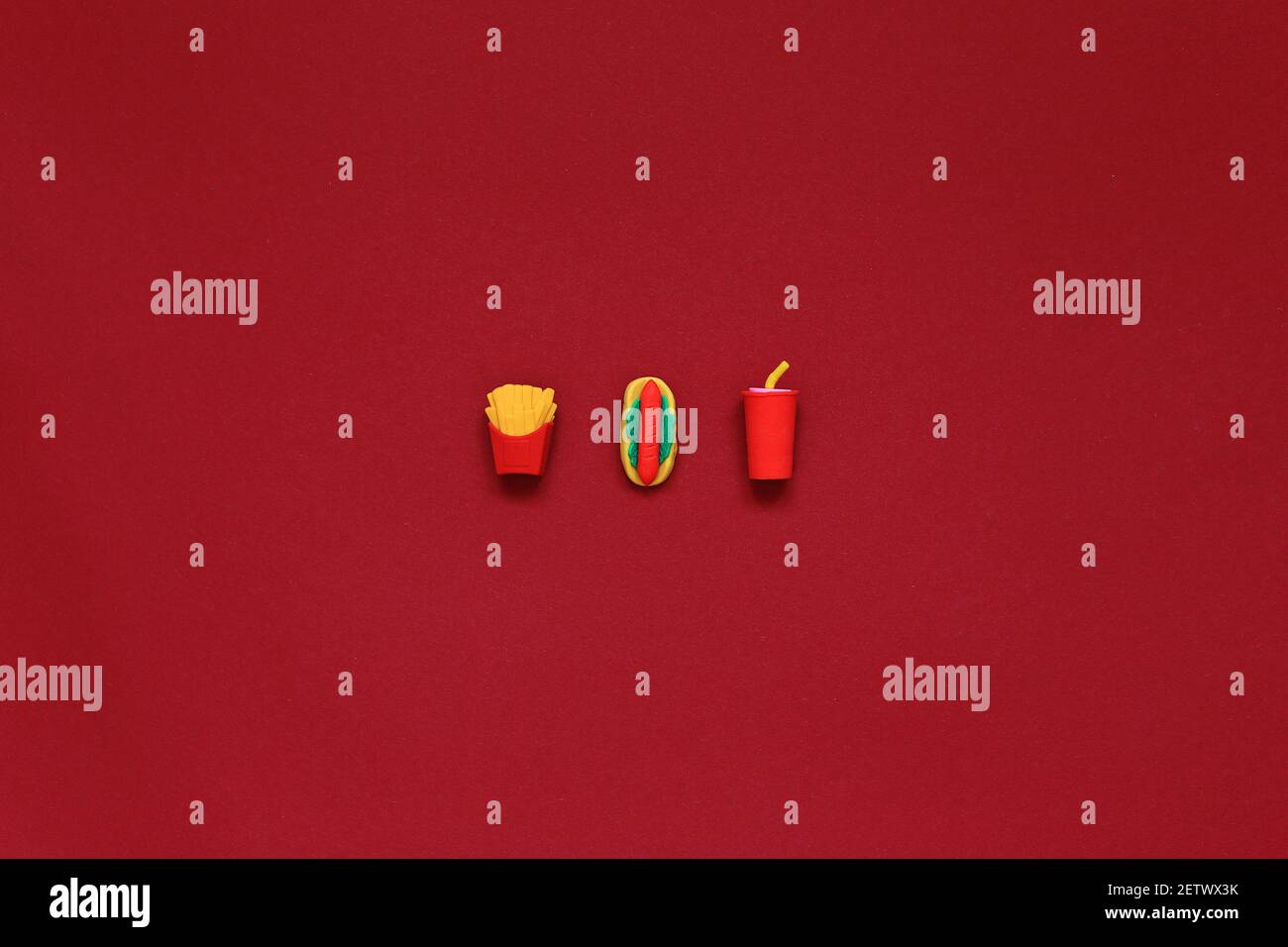 Fast food lies on a red background. Food in the background. High ...