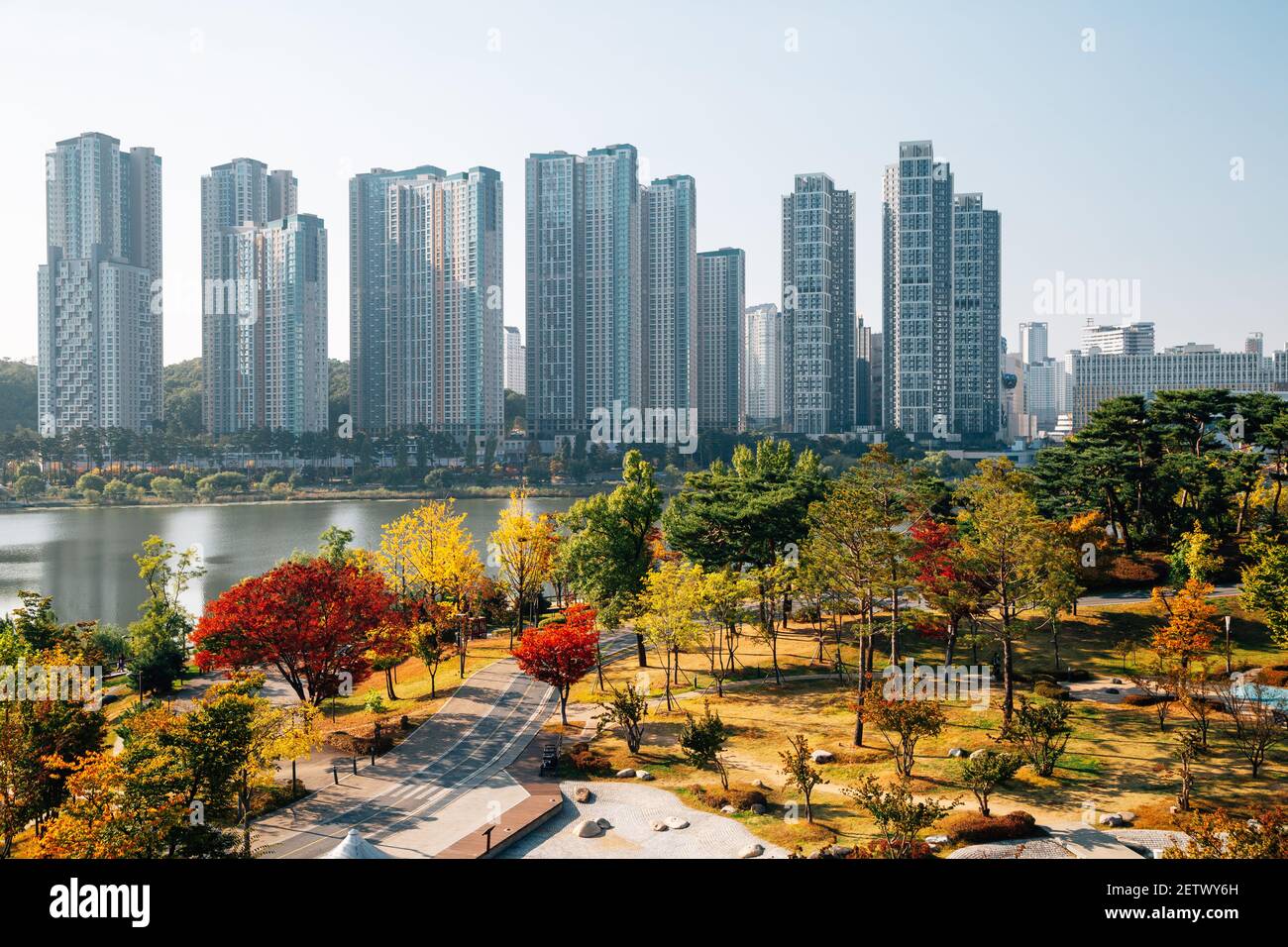 View of modern skyscrapers and Gwanggyo Lake Park at autumn in Suwon ...