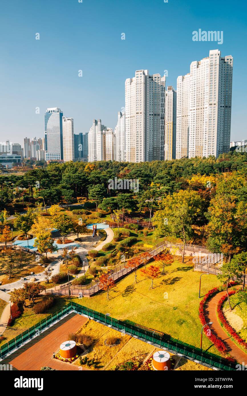 View of modern skyscrapers and Gwanggyo Lake Park at autumn in Suwon ...