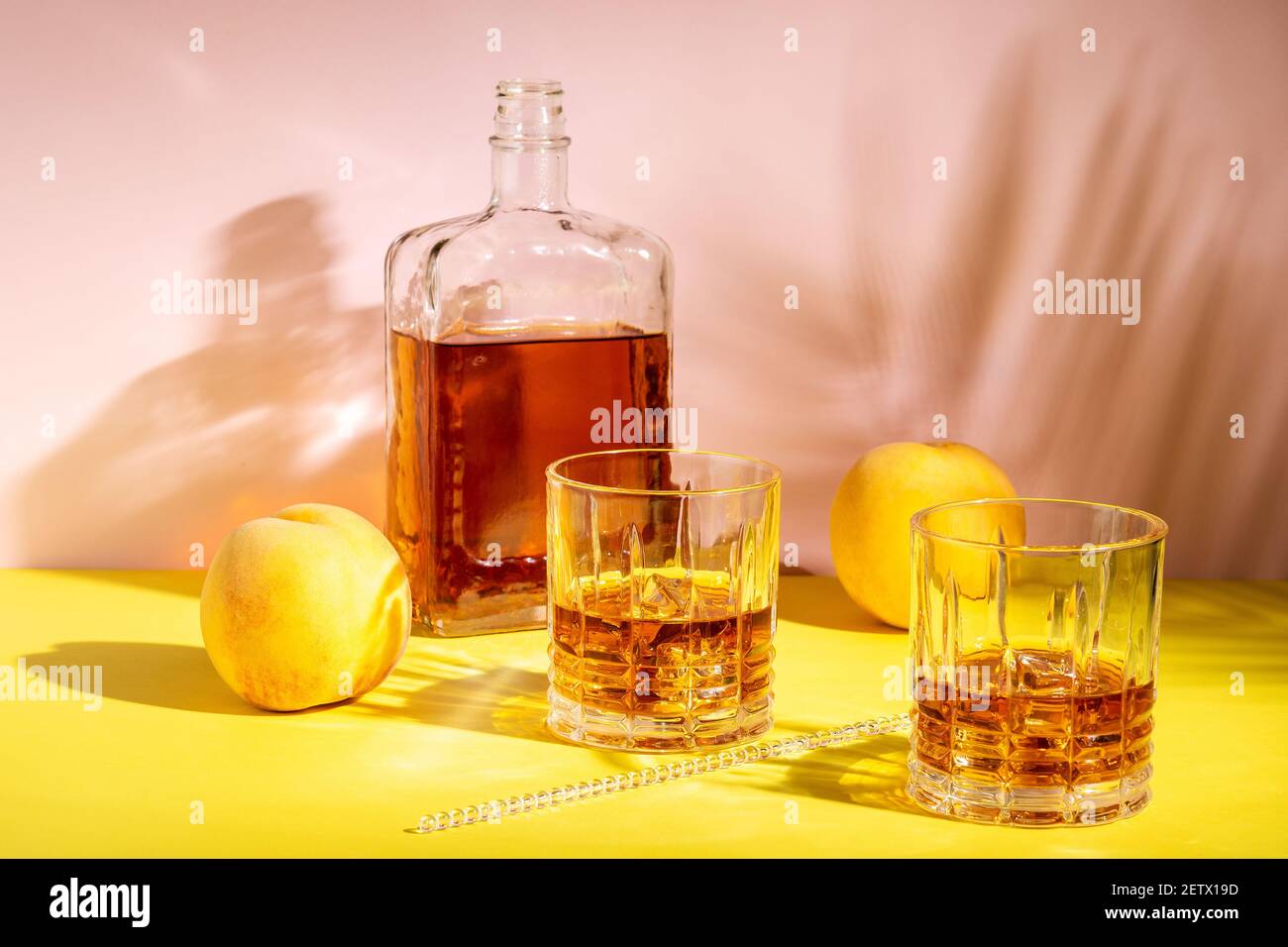 Rum or Amaretto sour with ice in a glass on a bright background. Summer ...