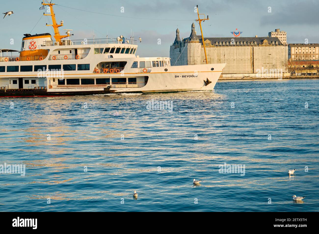Public transportation by ferry in bosporus with ancient train station ...