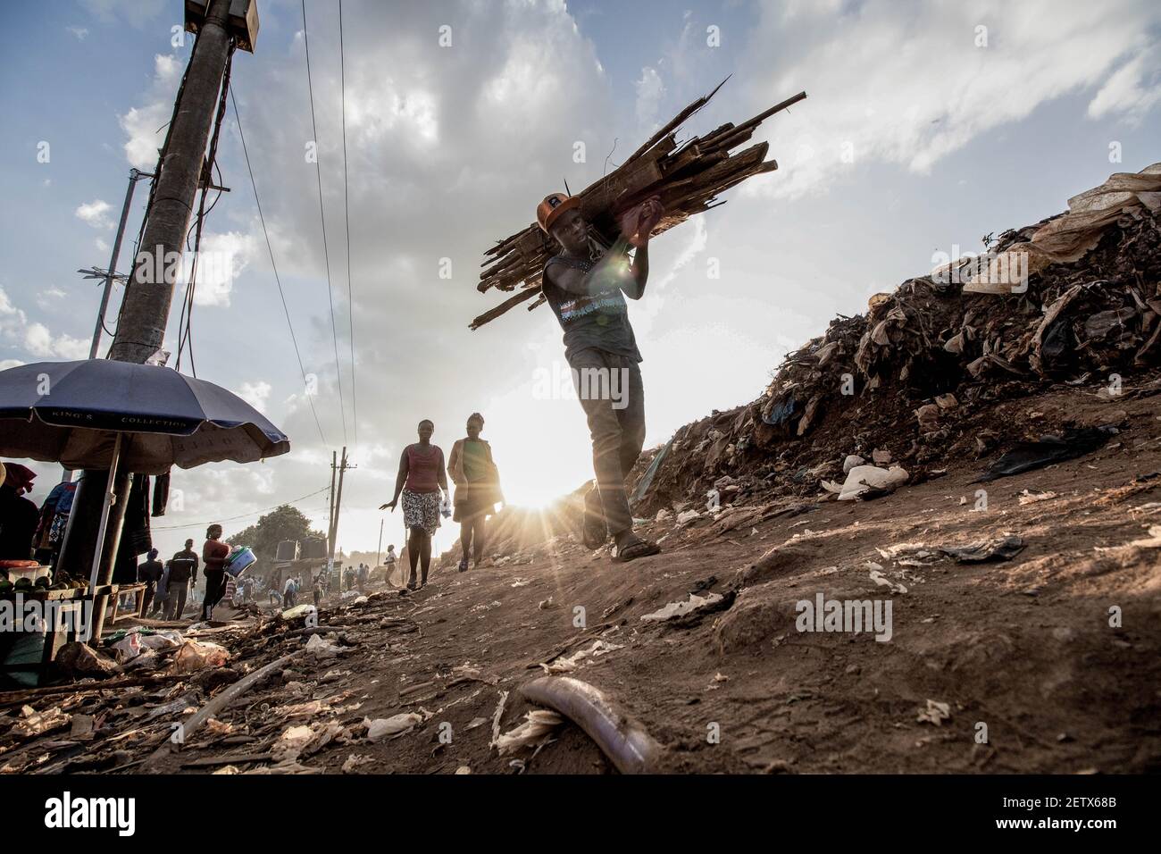Nairobi, Kenya. 1st Mar, 2021. Homeless residents walk past the rubbles ...