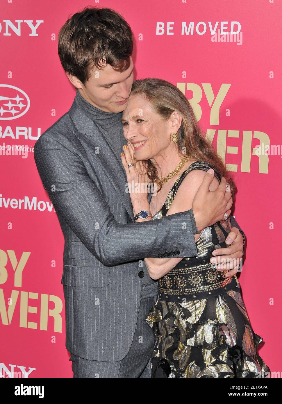 (L-R) Ansel Elgort and Mom Grethe Barrett Holby arrives at the "Baby ...
