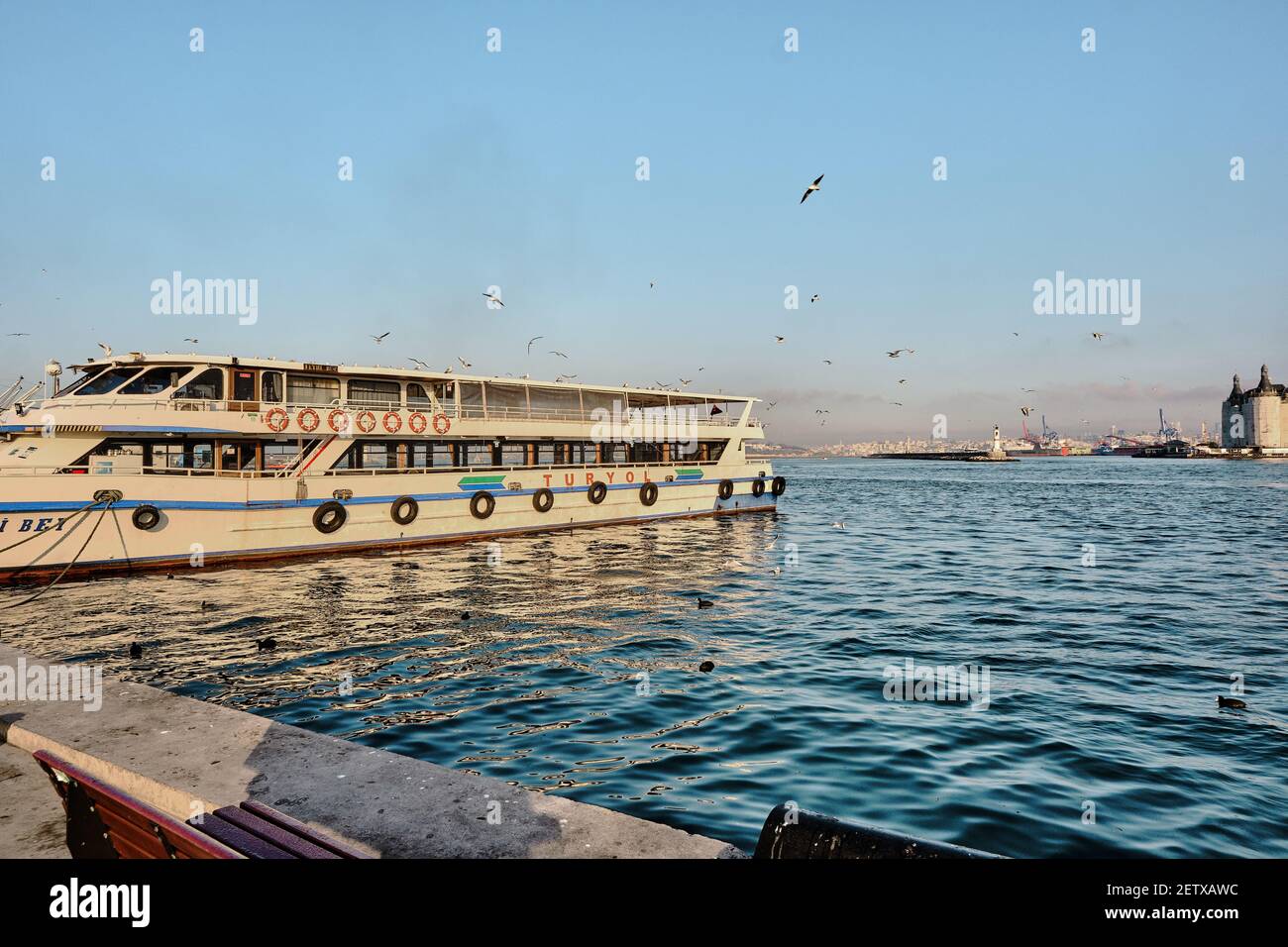 Public transportation by ferry in bosporus with ancient train station ...