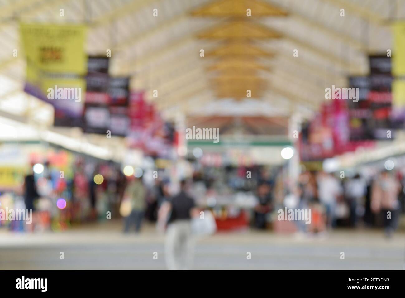 Blurred image of shopping mall and people walking for background usage ...