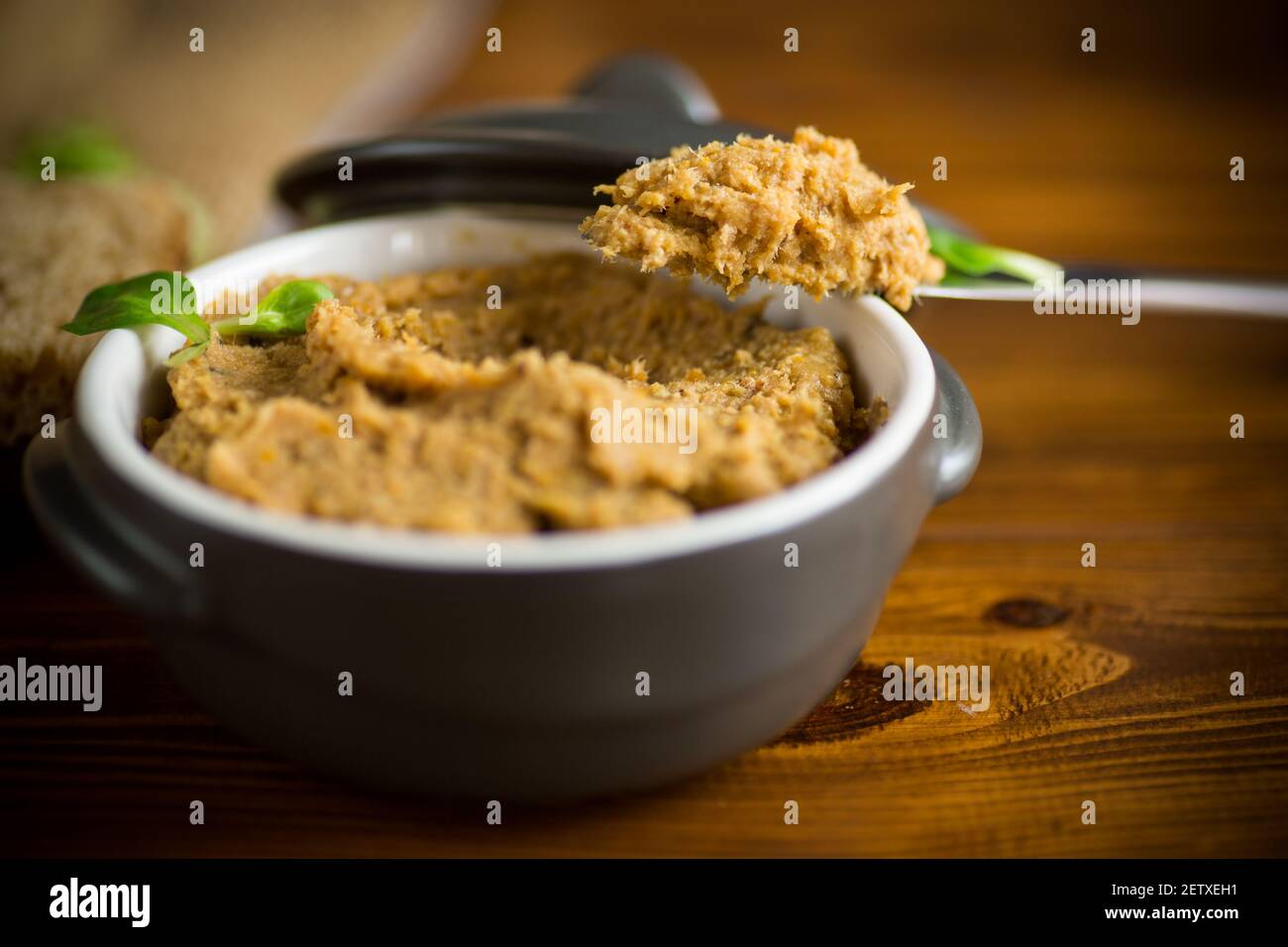 cooked homemade meat pate in a ceramic bowl on a wooden table Stock ...