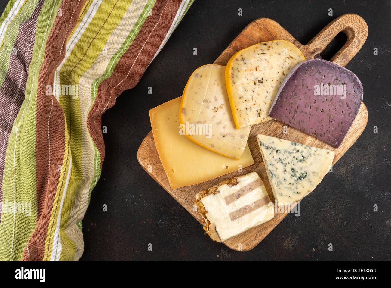 Various types of exclusive cheeses on dark background. Top view Stock ...