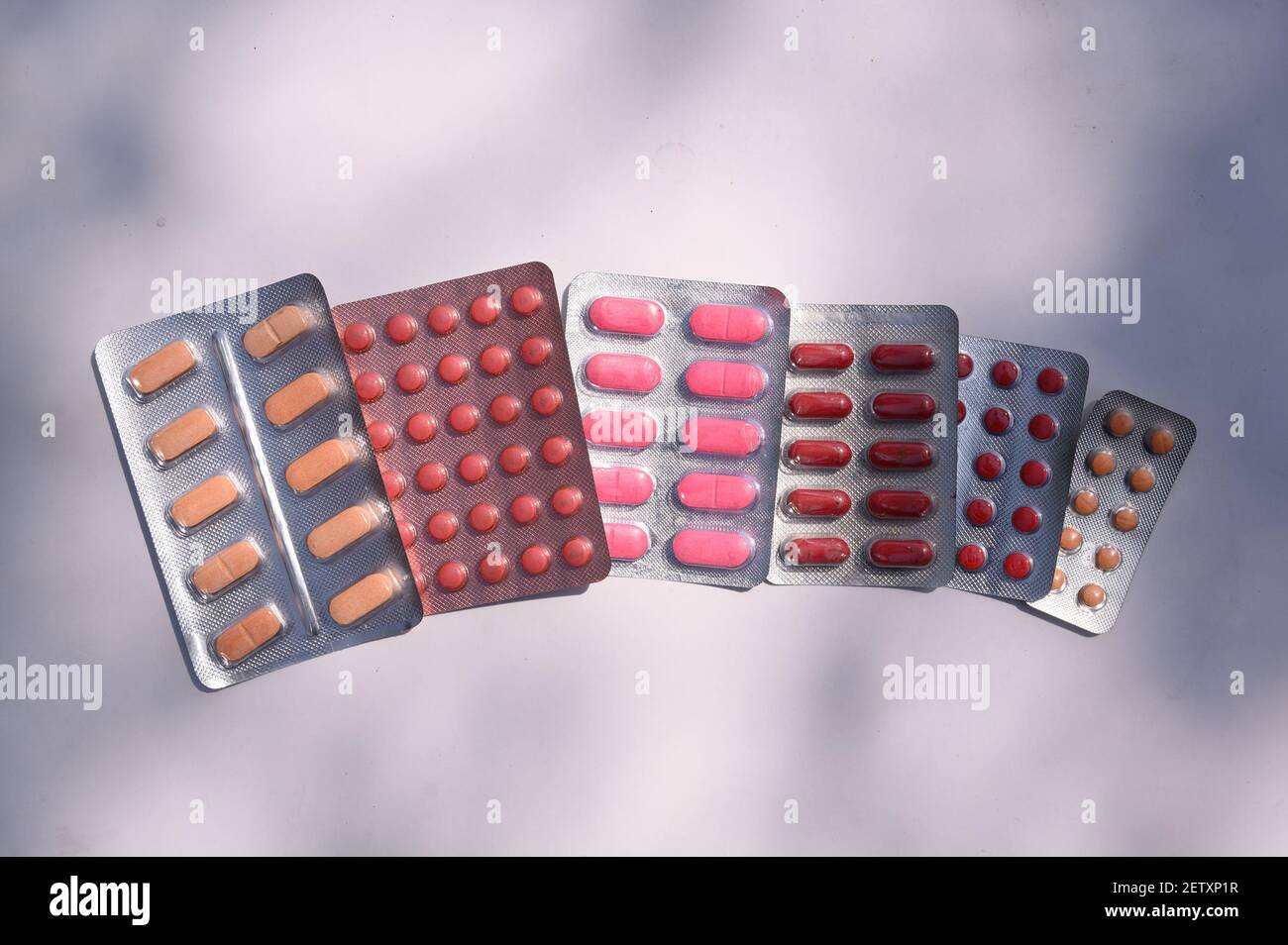 Red and Orange Color Capsule or Pills Medicine on white background in ...