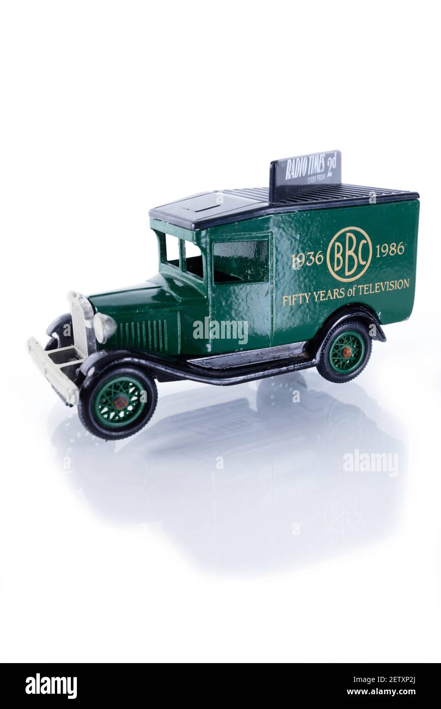 Worn diecast vehicle of an old BBC van. Isolated on a white background ...