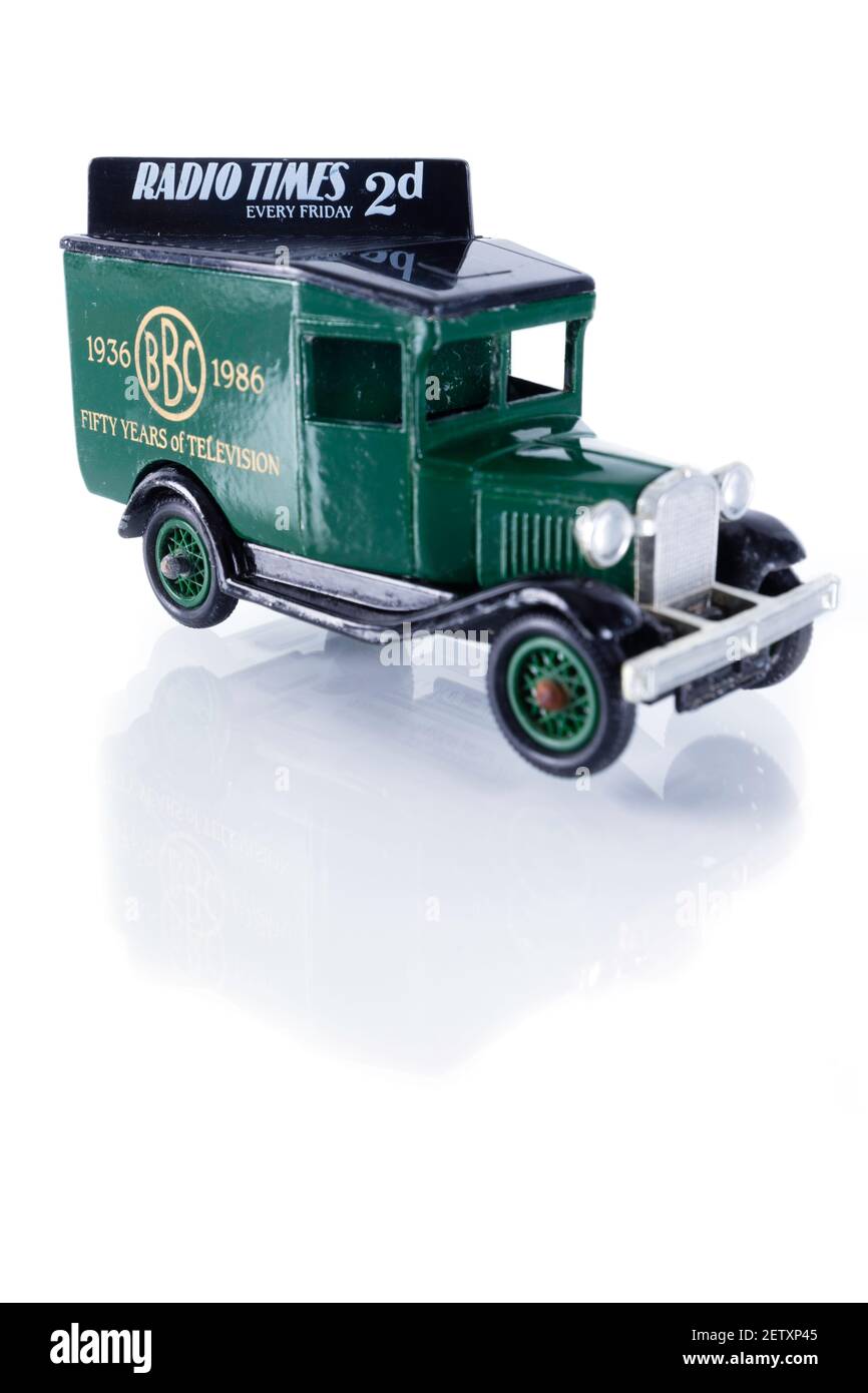 Worn diecast vehicle of an old BBC van. Isolated on a white background ...