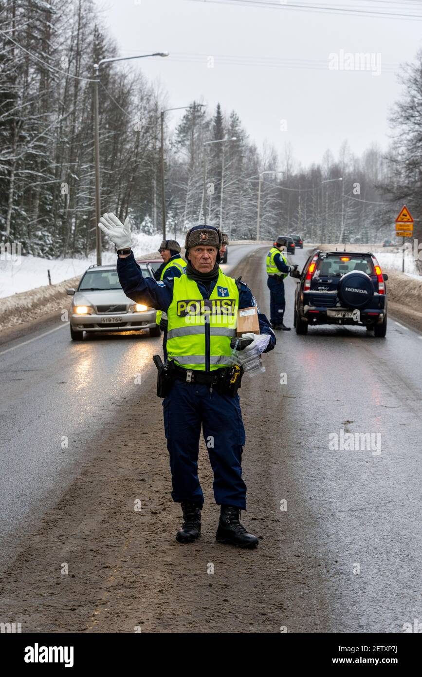 Finnish Police officers breathalysing drivers at random on the main ...