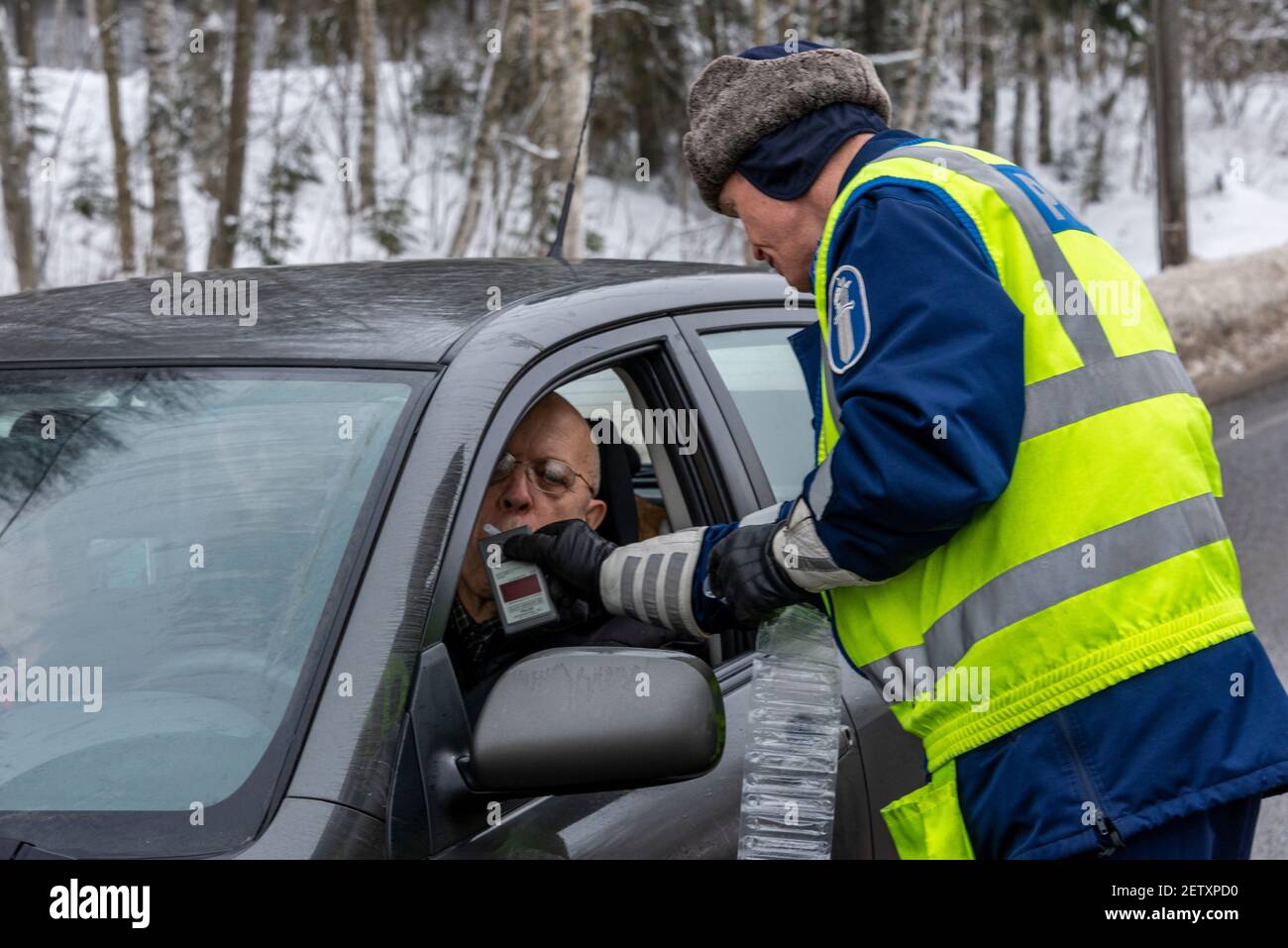 Finnish Police officers breathalysing drivers at random on the main ...