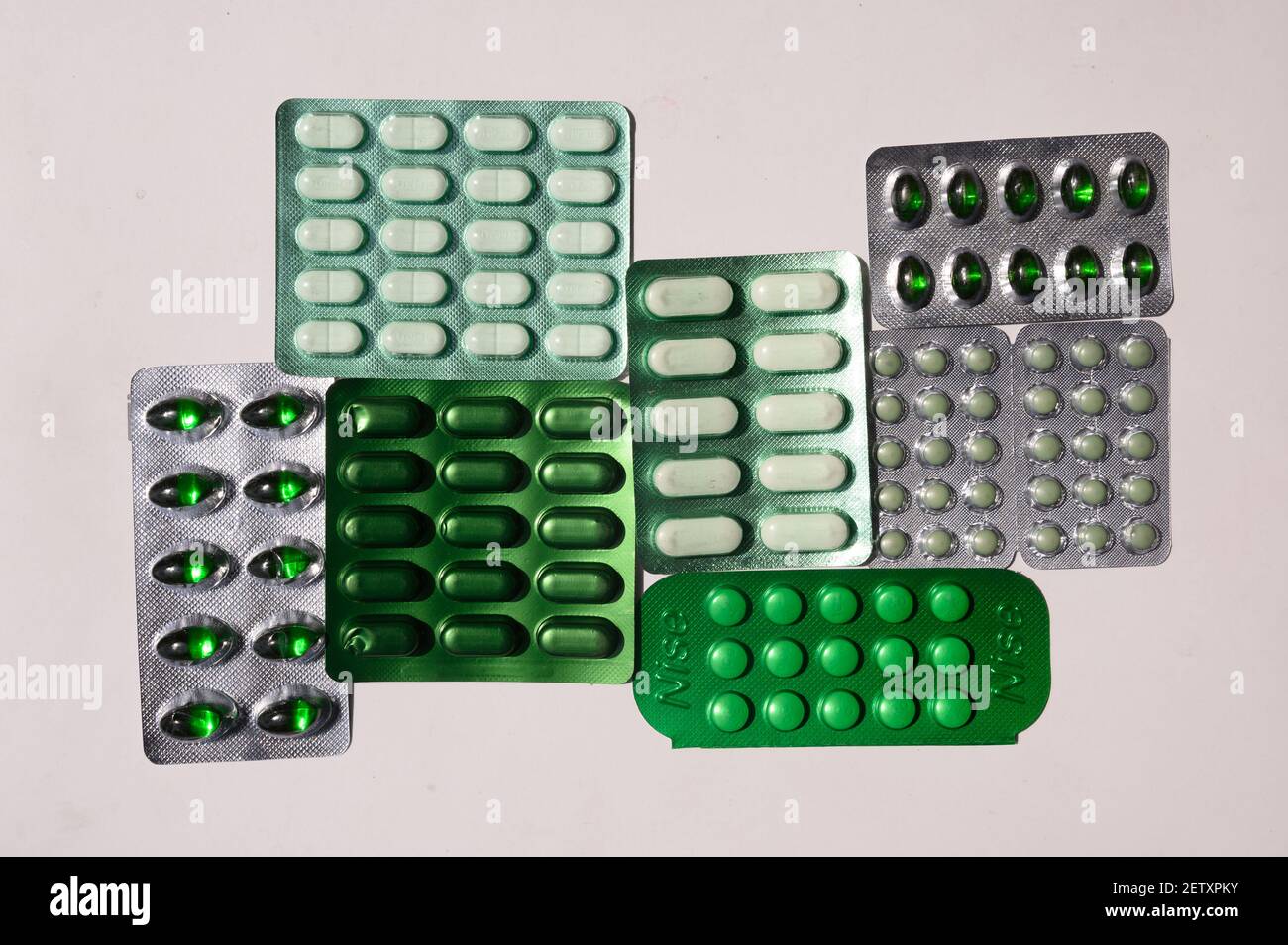 Green Color Capsule or Pills Medicine on white background in natural ...