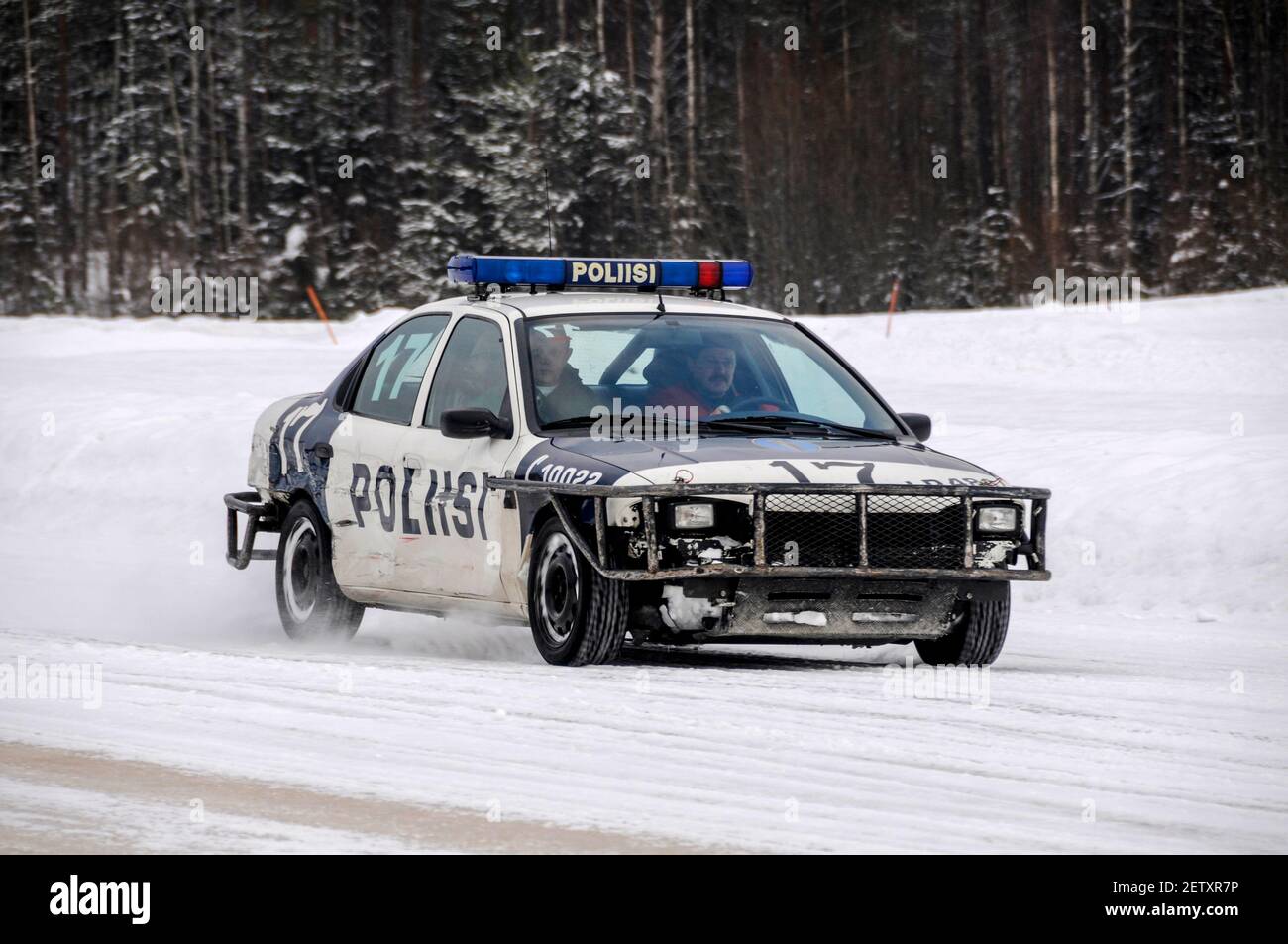 A Finnish Traffic Police car speeds along a snow-covered road as part ...