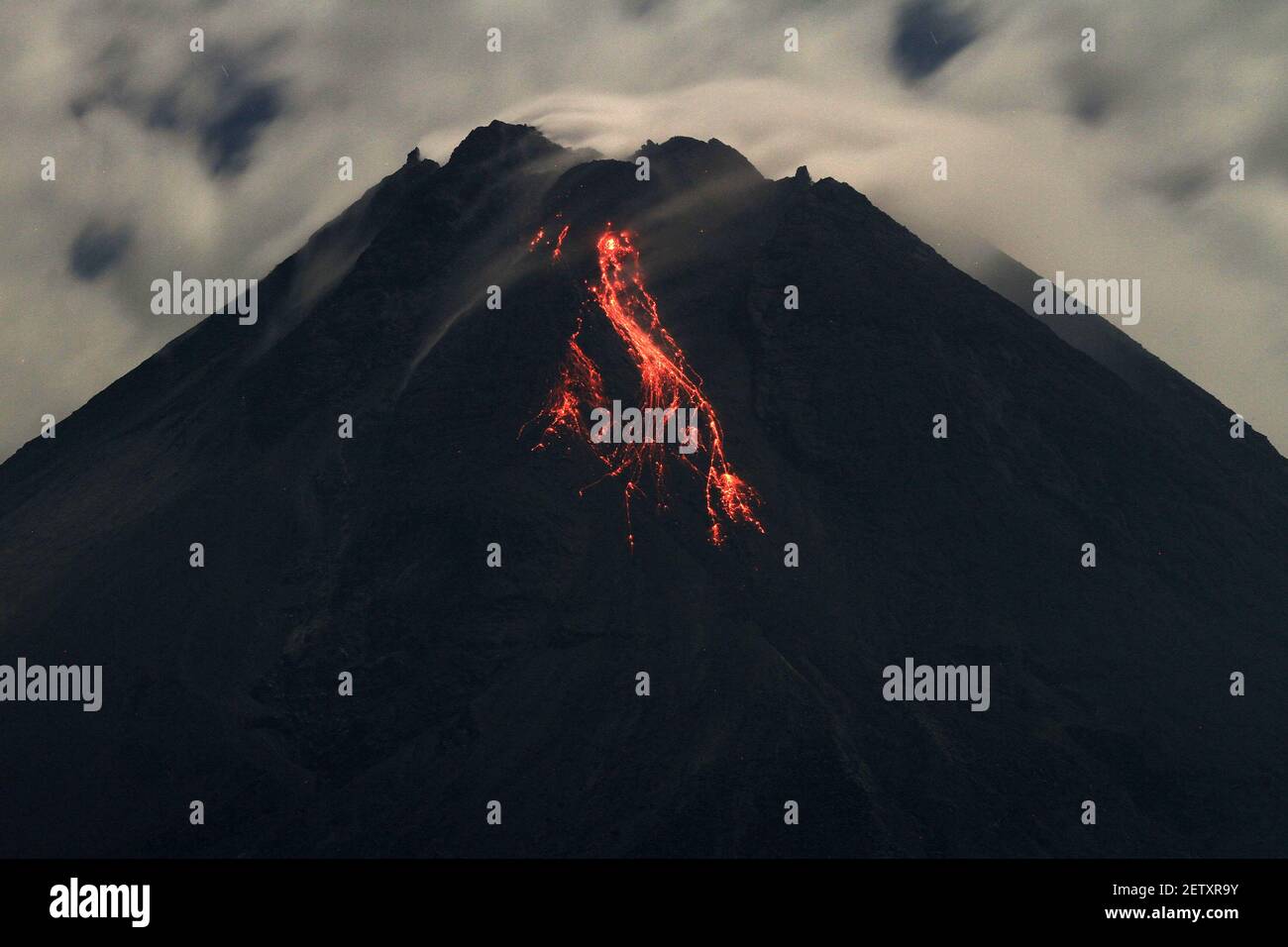 Lava is flowing down from Mount Merapi as seen from Tungguarum village ...